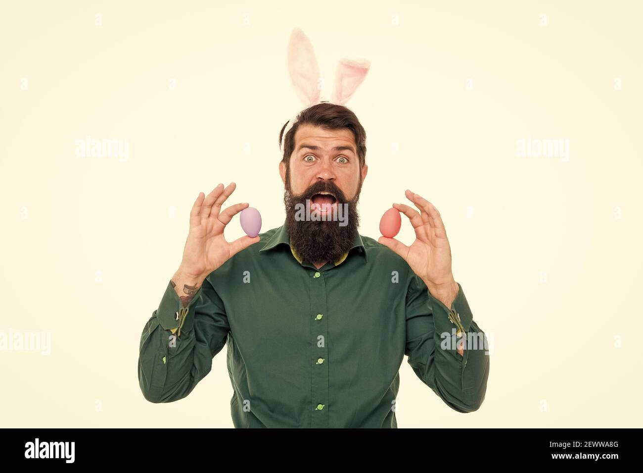 Easter Egg surprise. Surprised hipster hold eggs. Bearded man open ...