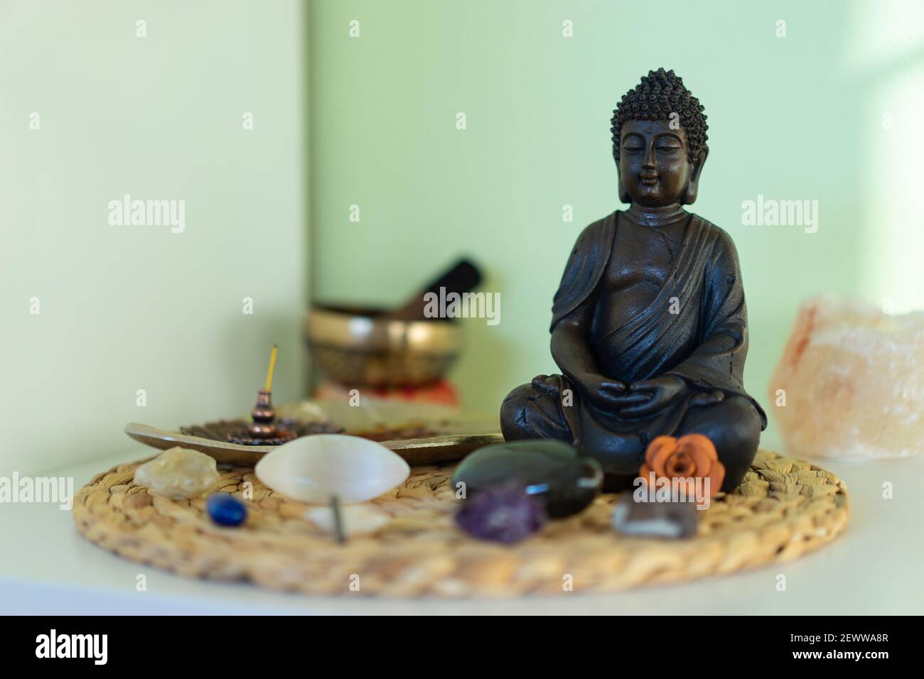 Meditation corner with Buddha statue in the bedroom Stock Photo - Alamy