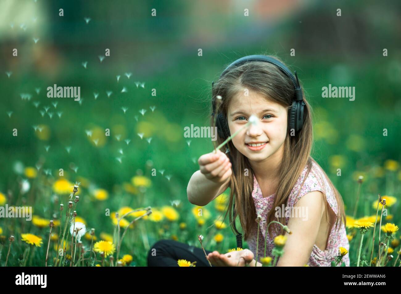 Little Funny Girl In Headphones In The Green Field Stock Photo Alamy little-funny-girl-in-headphones-in-the-green-field-stock-photo-alamy