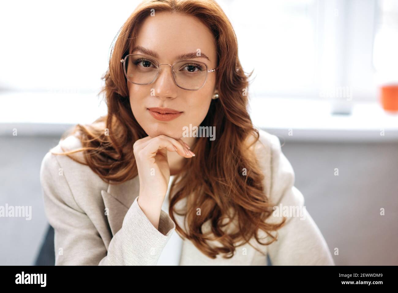 Portrait of gorgeous redhead business woman in stylish formal wear and ...