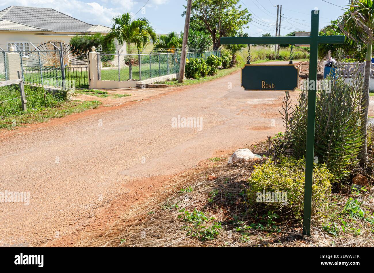 Road Sign At Side of Empty Road Stock Photo - Alamy