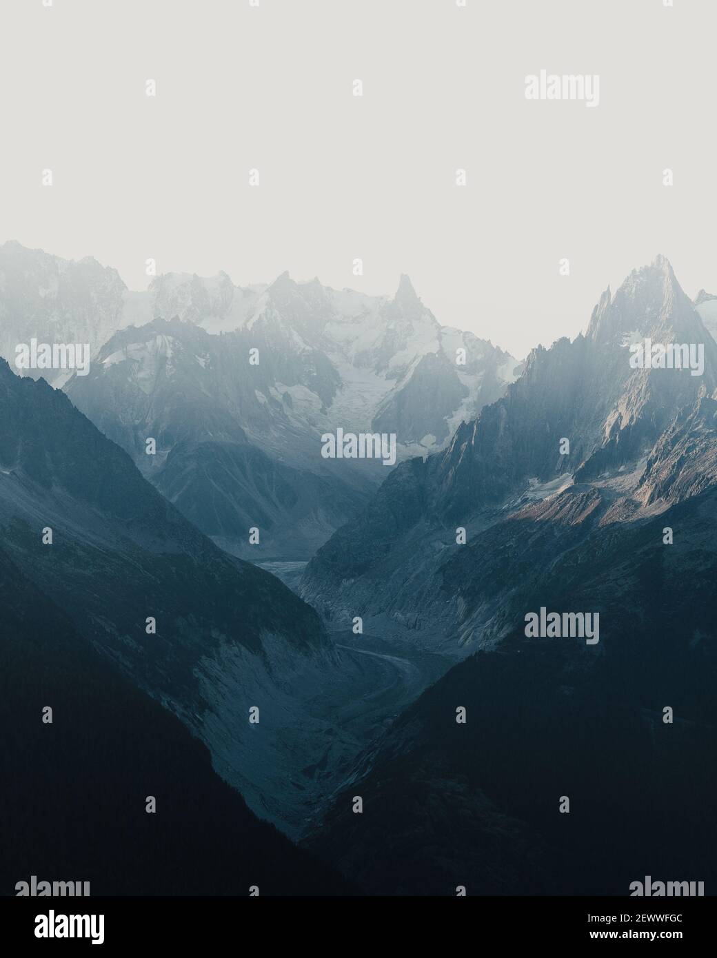A vertical shot of the French Alps on a foggy day Stock Photo - Alamy
