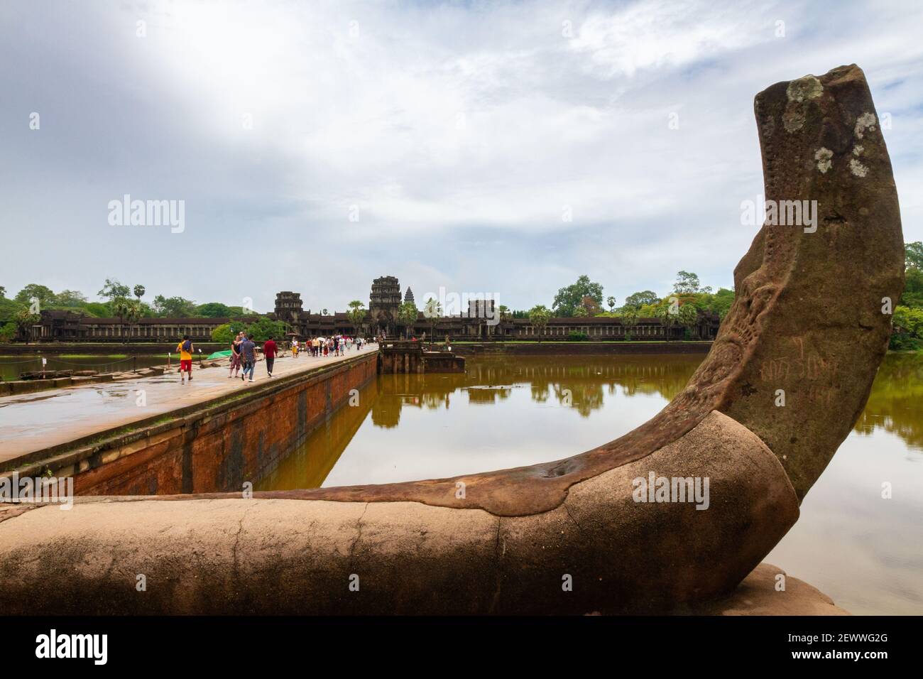 Angkor Wat, Cambodia - June 23, 2016: A stone bridge approaches the ...