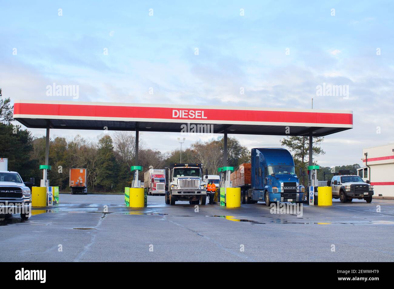 Richmond County, Ga USA - 03 03 21: Trucks and man pumping diesel fuel ...