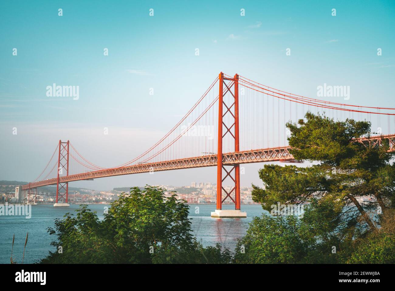 25 De April Bridge. Red bridge is connecting Lisbon and Almada across ...