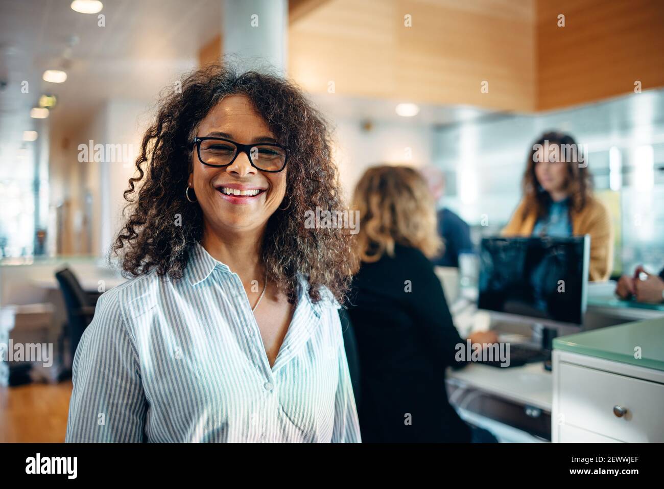 Portrait of a friendly municipal office administrator. Mature woman ...