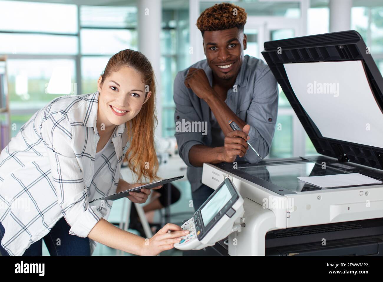 happy two workers and printer maintenance Stock Photo - Alamy