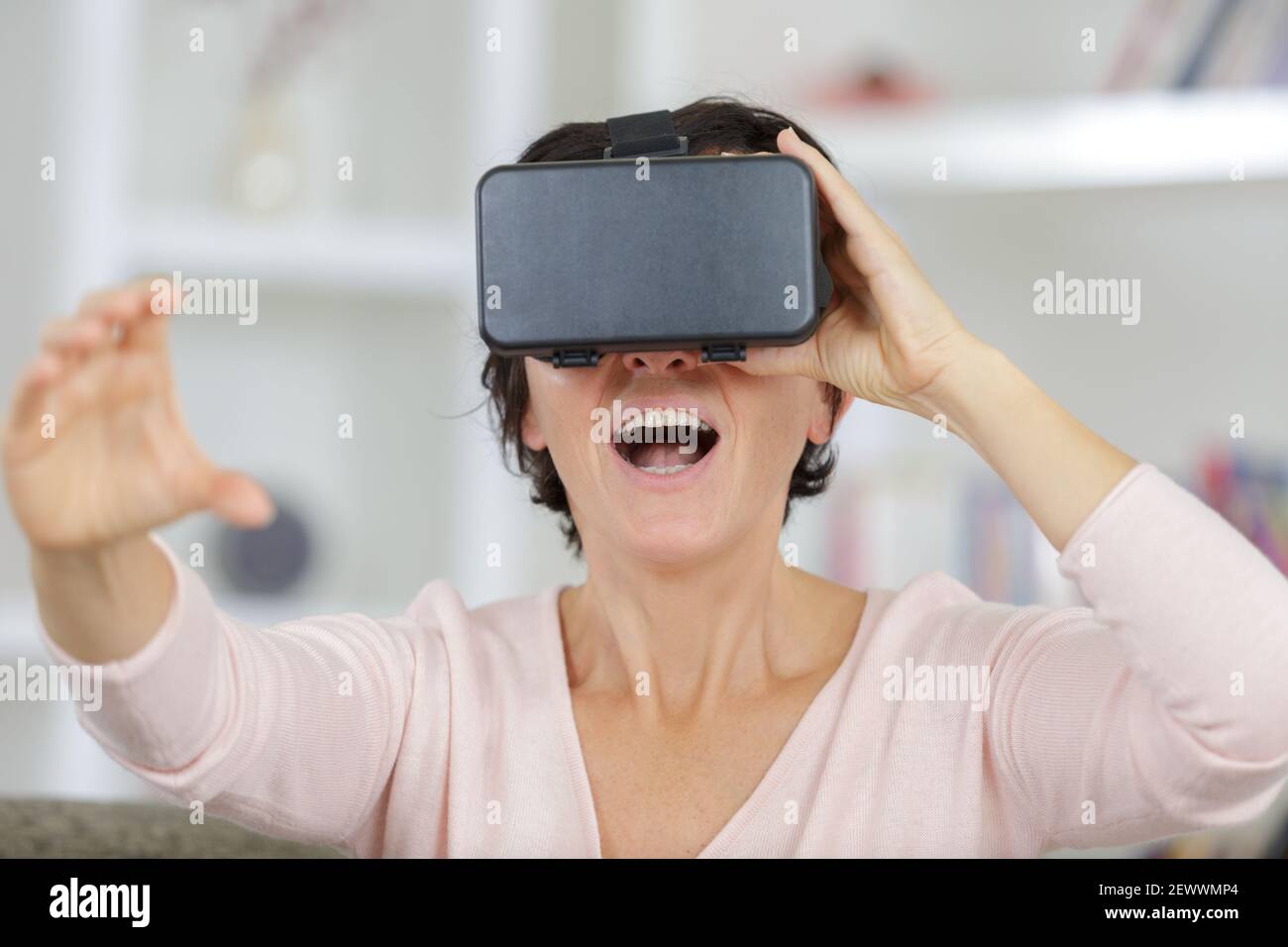 Woman vr glasses controller hi-res stock photography and images - Alamy