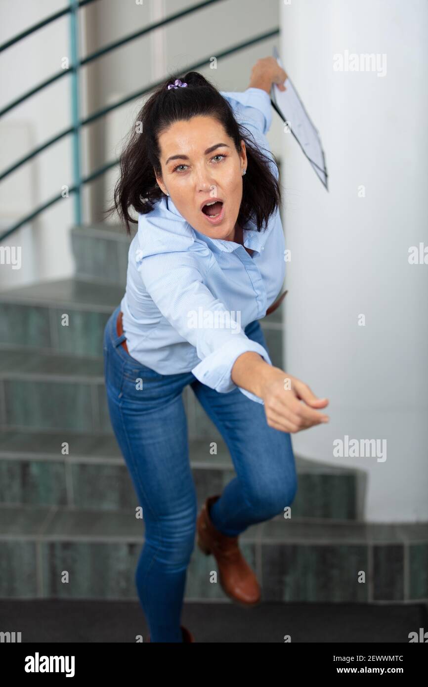 Girl falling down from stairs hi-res stock photography and images - Alamy