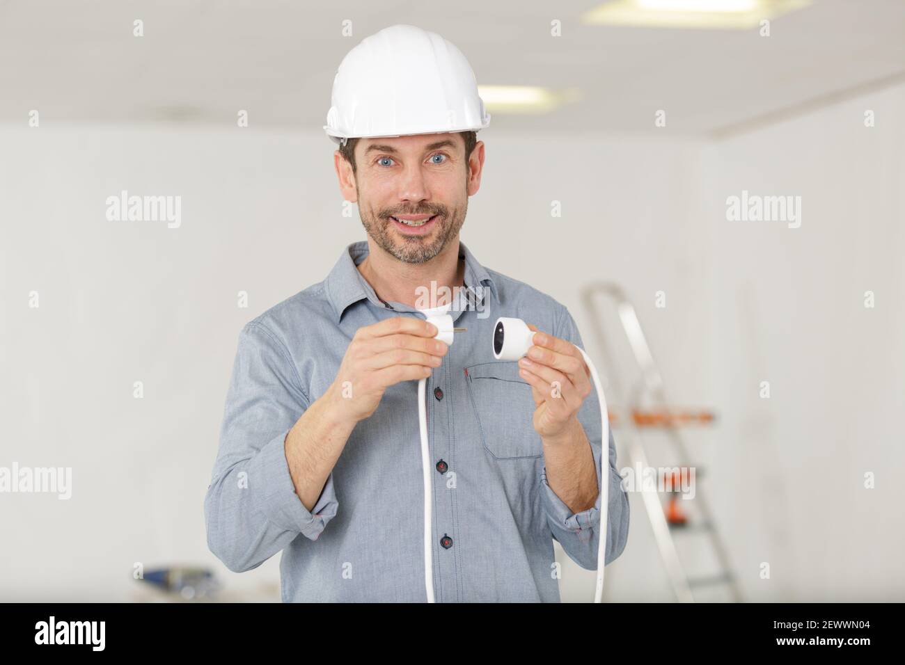 a man is connecting cables Stock Photo - Alamy