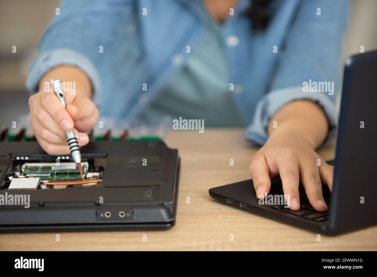removal of the battery by a service technician Stock Photo - Alamy