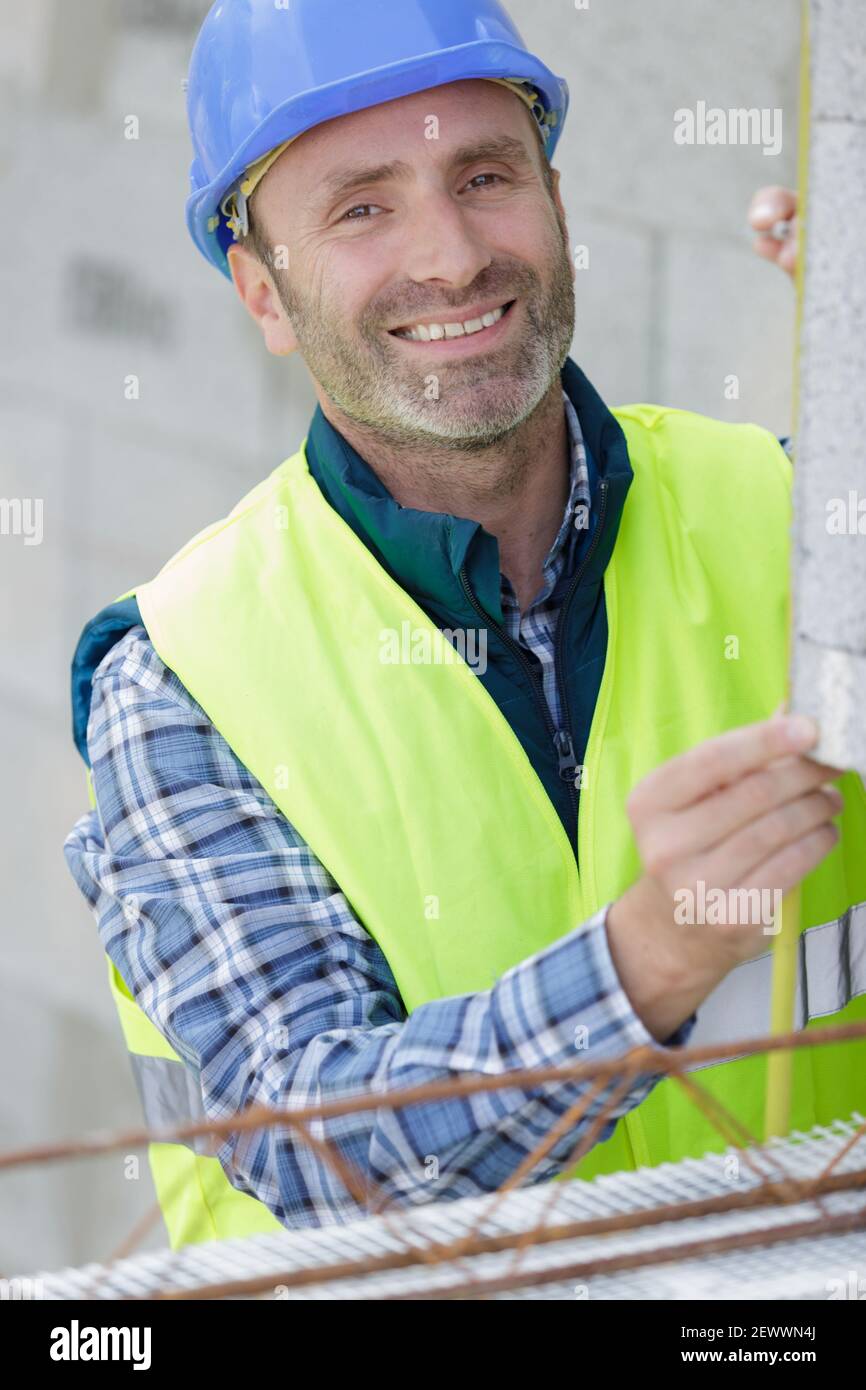 a happy constructor and worker outdoors Stock Photo - Alamy