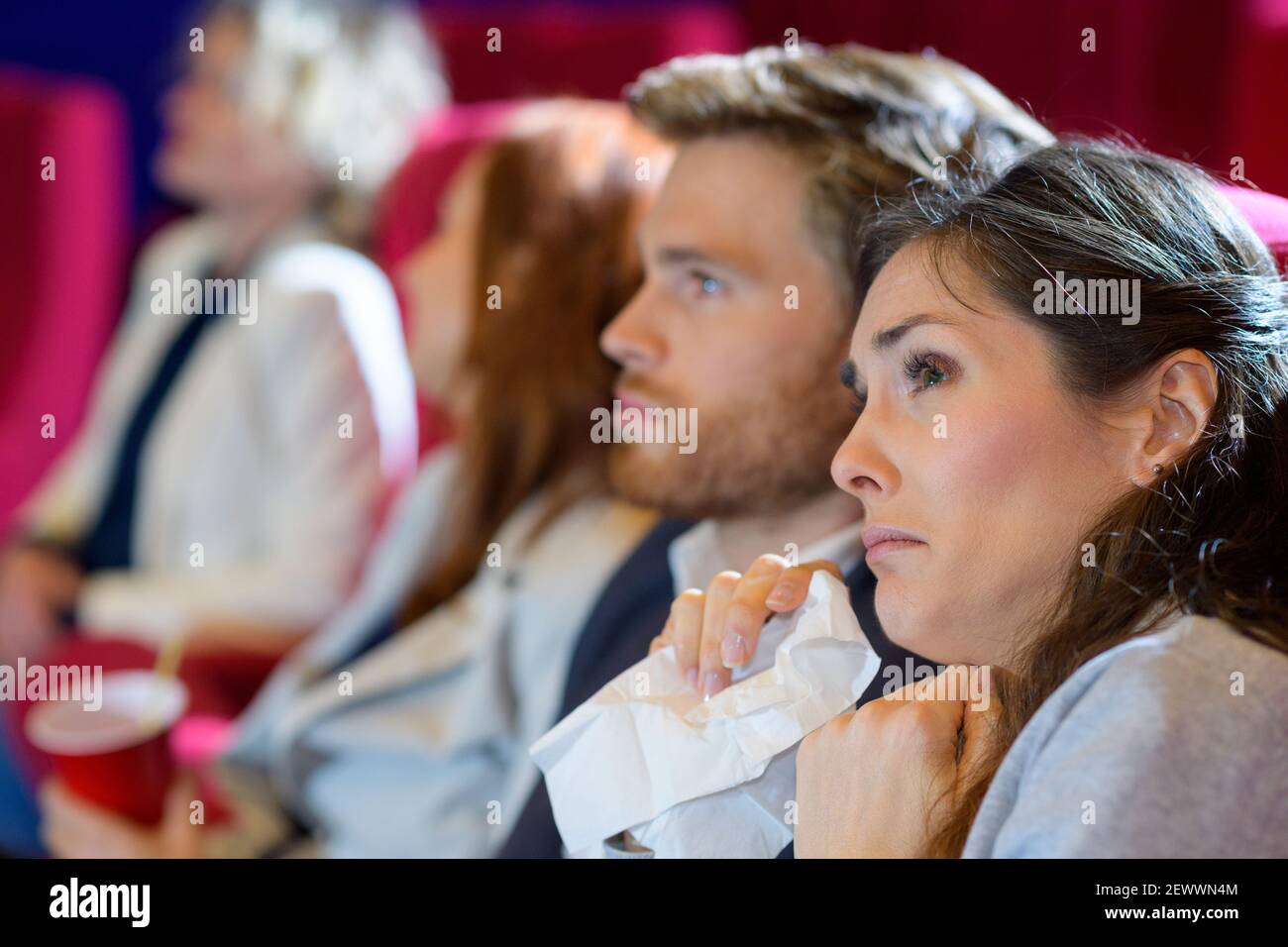 woman crying watching sad film at the movies Stock Photo - Alamy