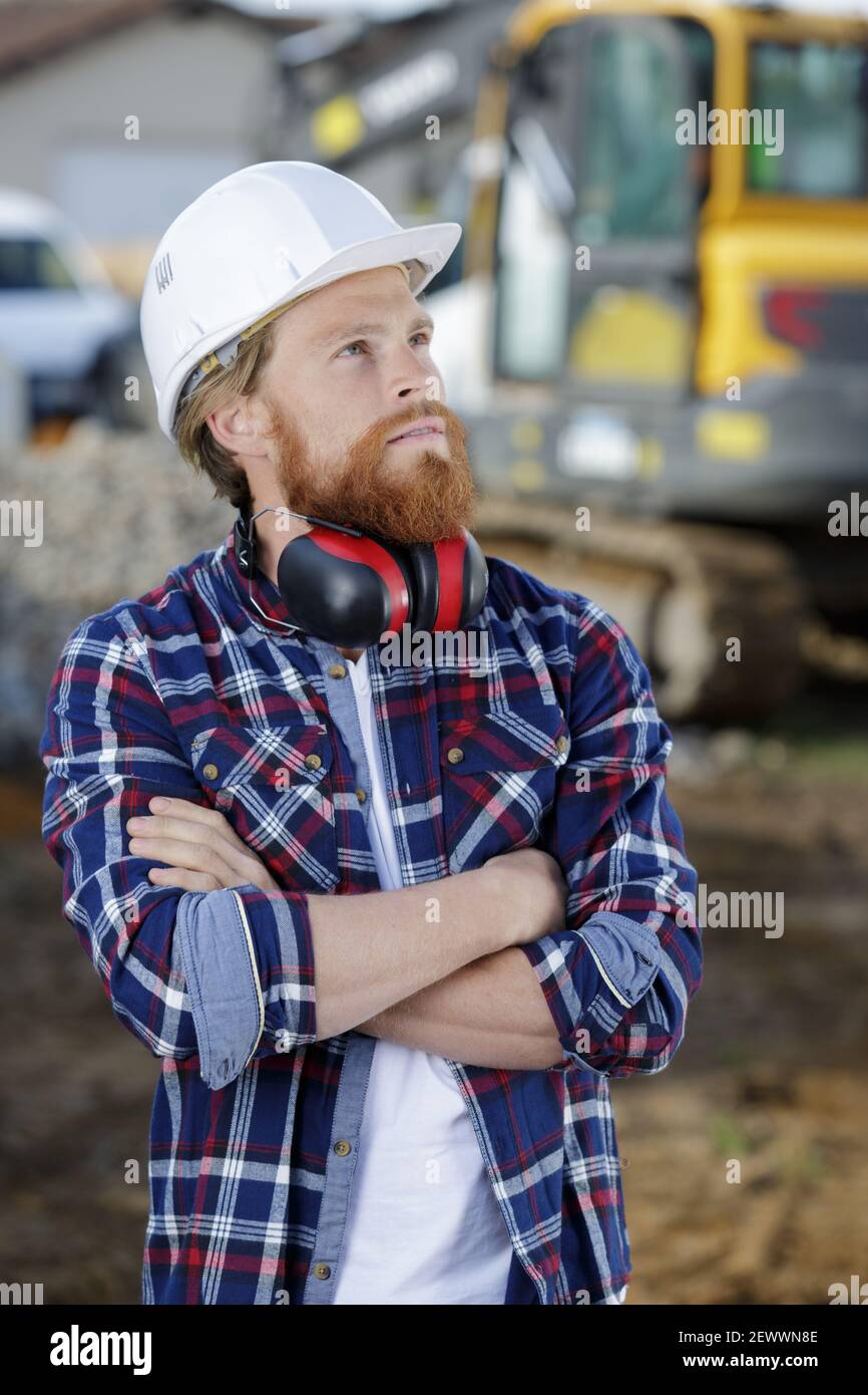 builder looking up on construction site Stock Photo - Alamy