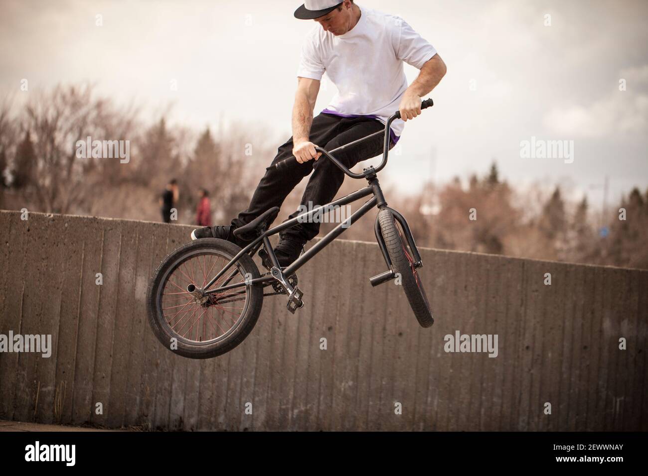 Young bmx rider trying to land trick Stock Photo - Alamy