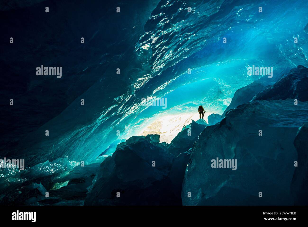 Mountaineer Exploring Massive Ice Cave In Banff National Park Stock ...