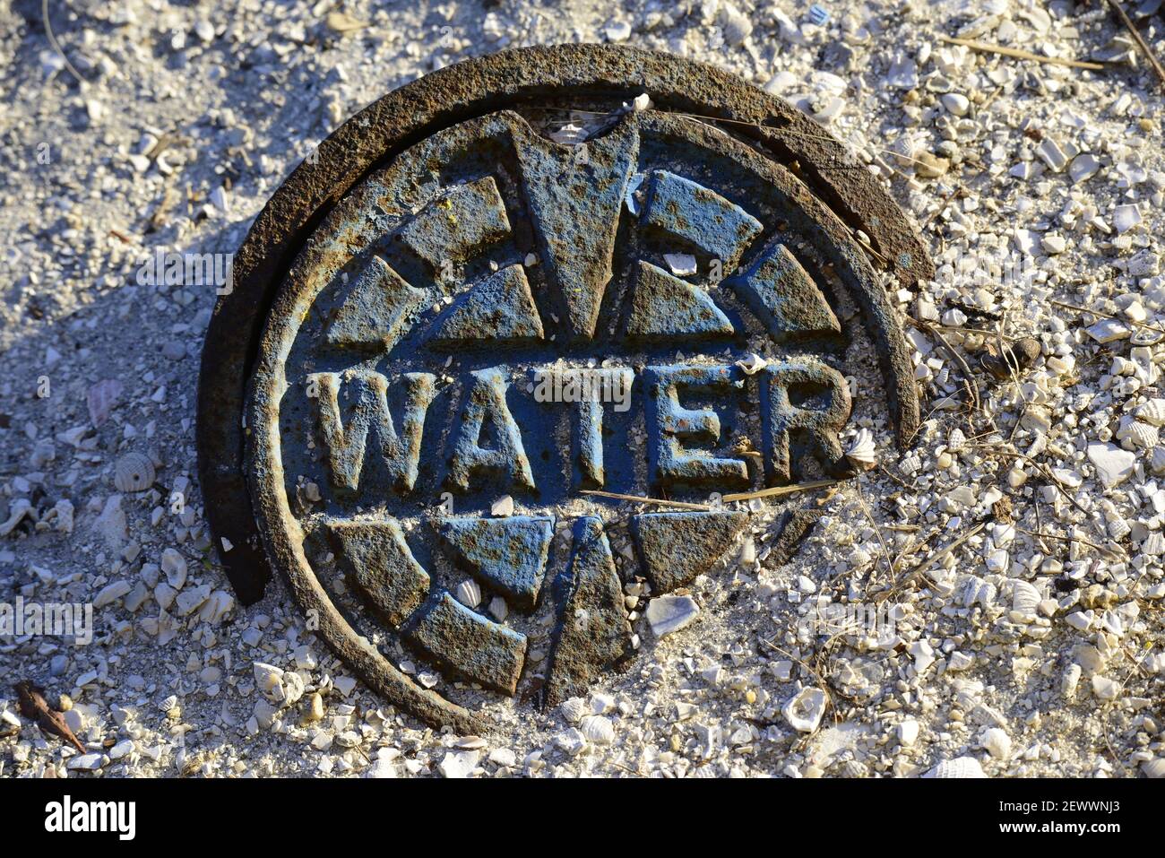 Water access cap covered with shells in Florida Stock Photo - Alamy