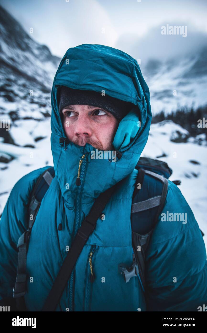 Portrait of man wearing puffy jacket in very cold conditions, Maine ...