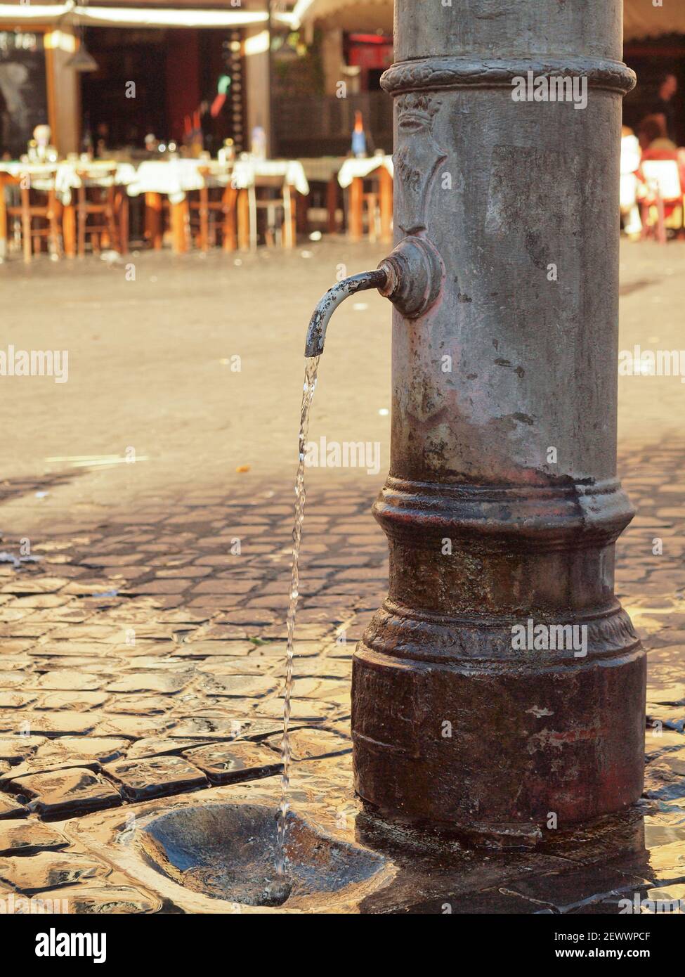 Nasoni water fountain on a street in Rome, Italy Stock Photo - Alamy