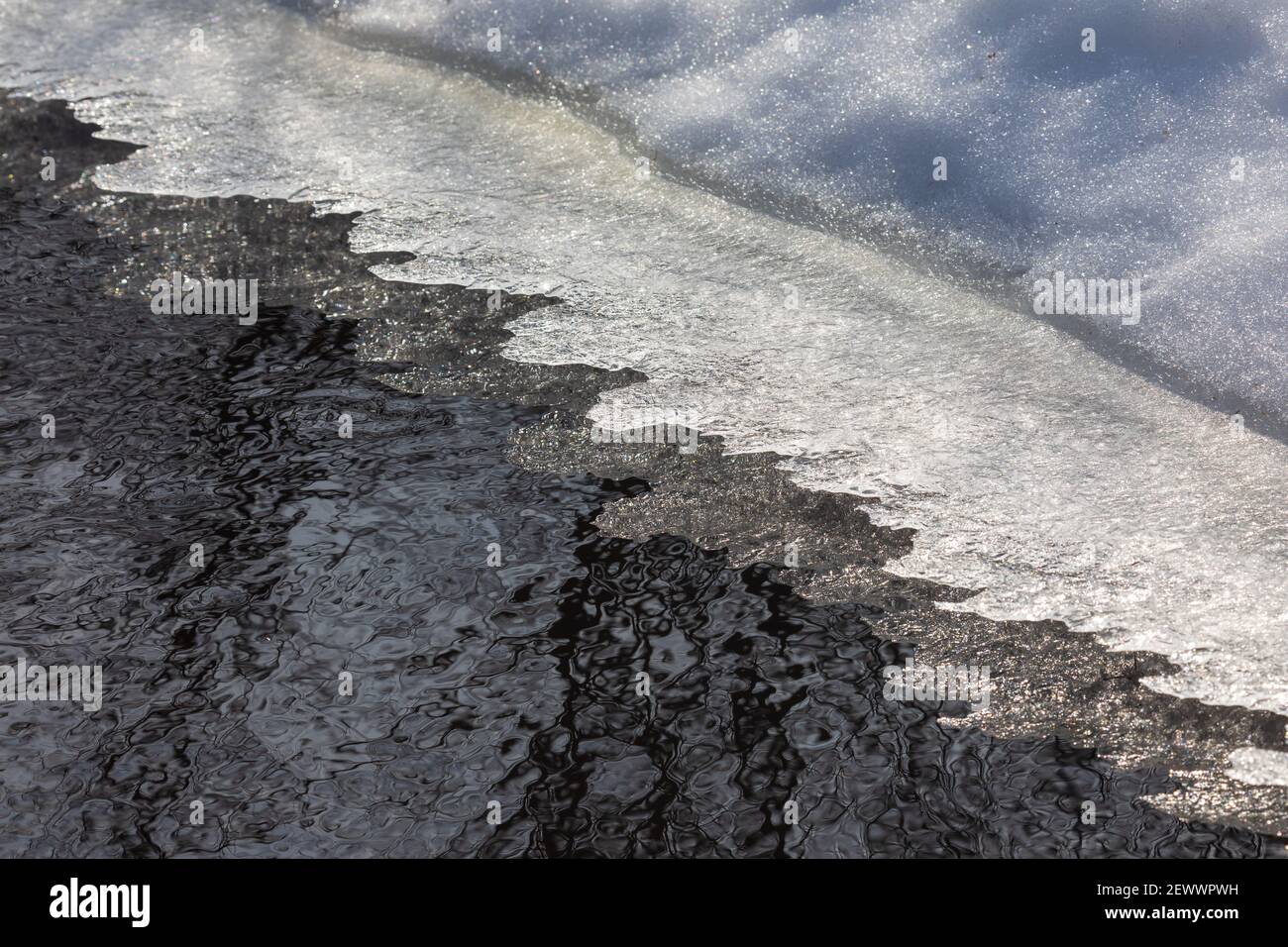 Spring thaw causing a jagged ice shelf in northern Wisconsin Stock ...