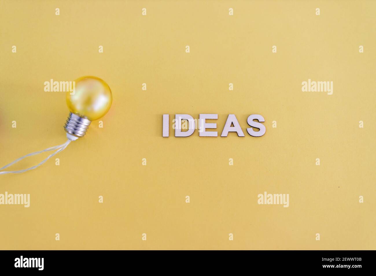 colorful yellow light bulb symbol of creativity and inventiveness on ...