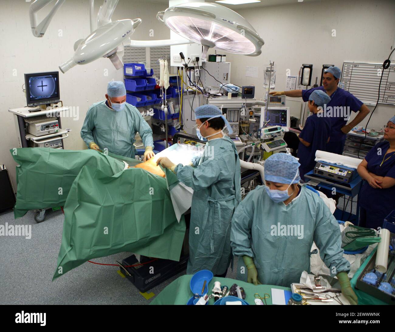 Dr. Chris Ogden with the Da Vinci surgical system Robot. The patient is ...