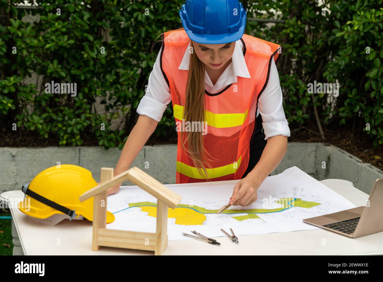 Engineer working on the engineering project at construction site. House ...