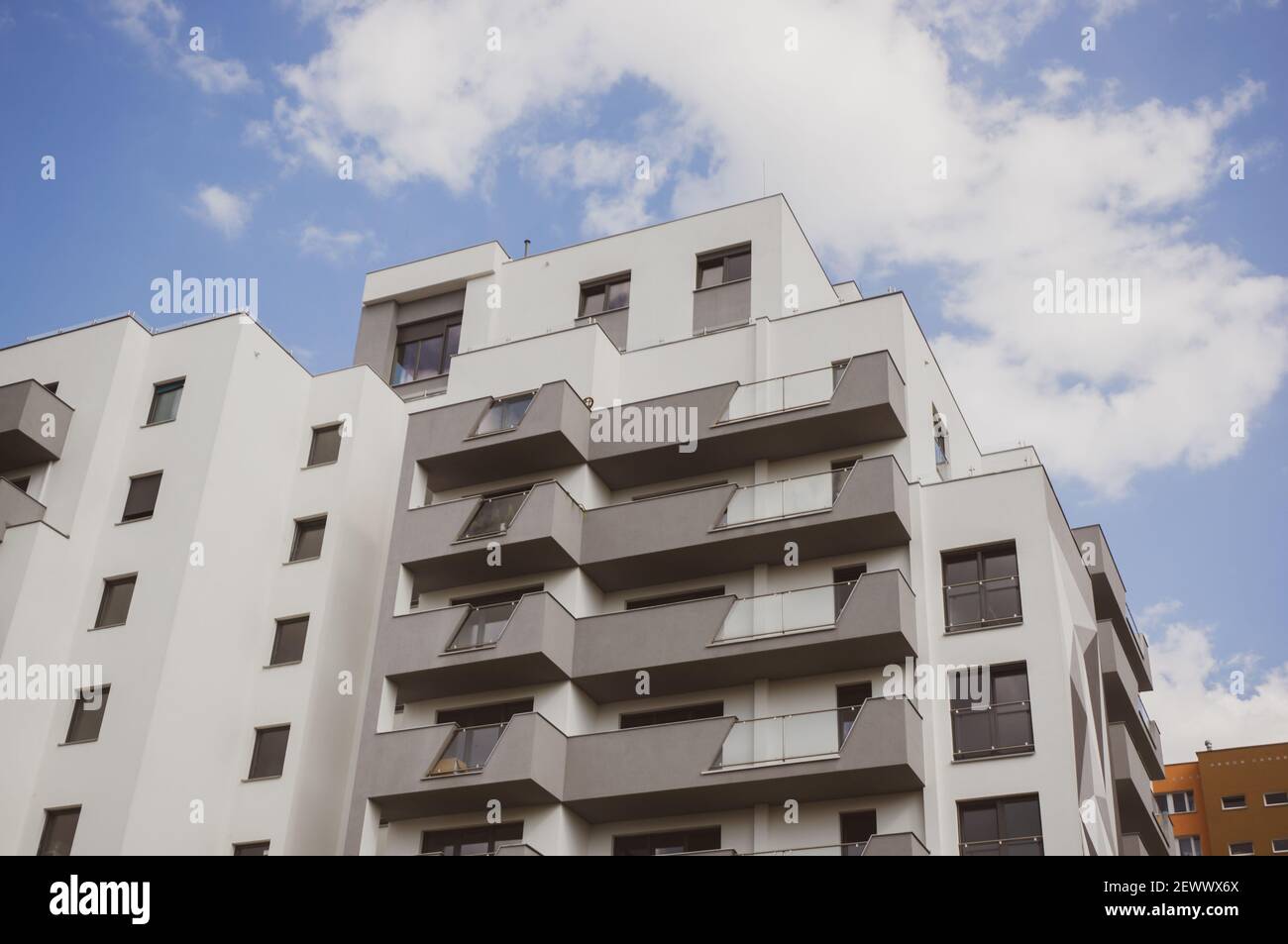 POZNAN, POLAND - Jul 08, 2018: Top of a modern apartment building with ...