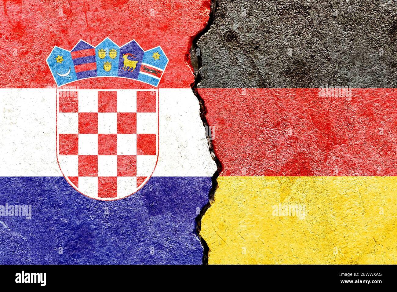 A closeup of Croatia VS Germany national flags painted on weathered ...