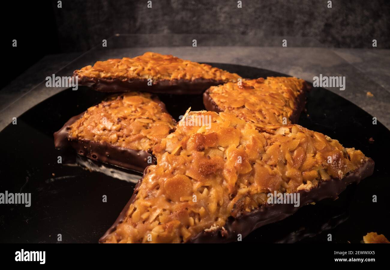 Sweet nut triangles with almonds - a German specialty Stock Photo - Alamy