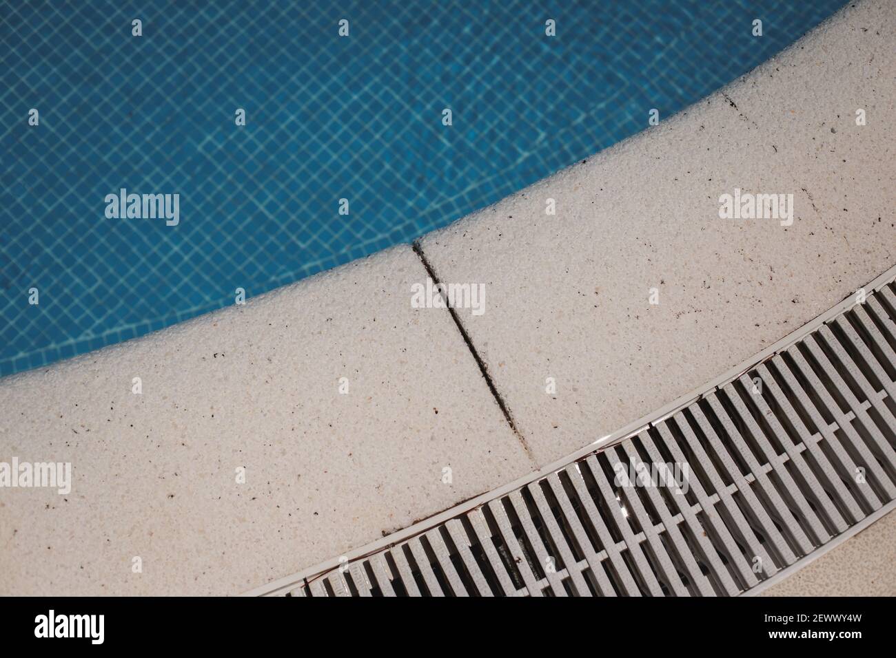 Top view of a swimming pool floor with blue tiled. Textured background ...