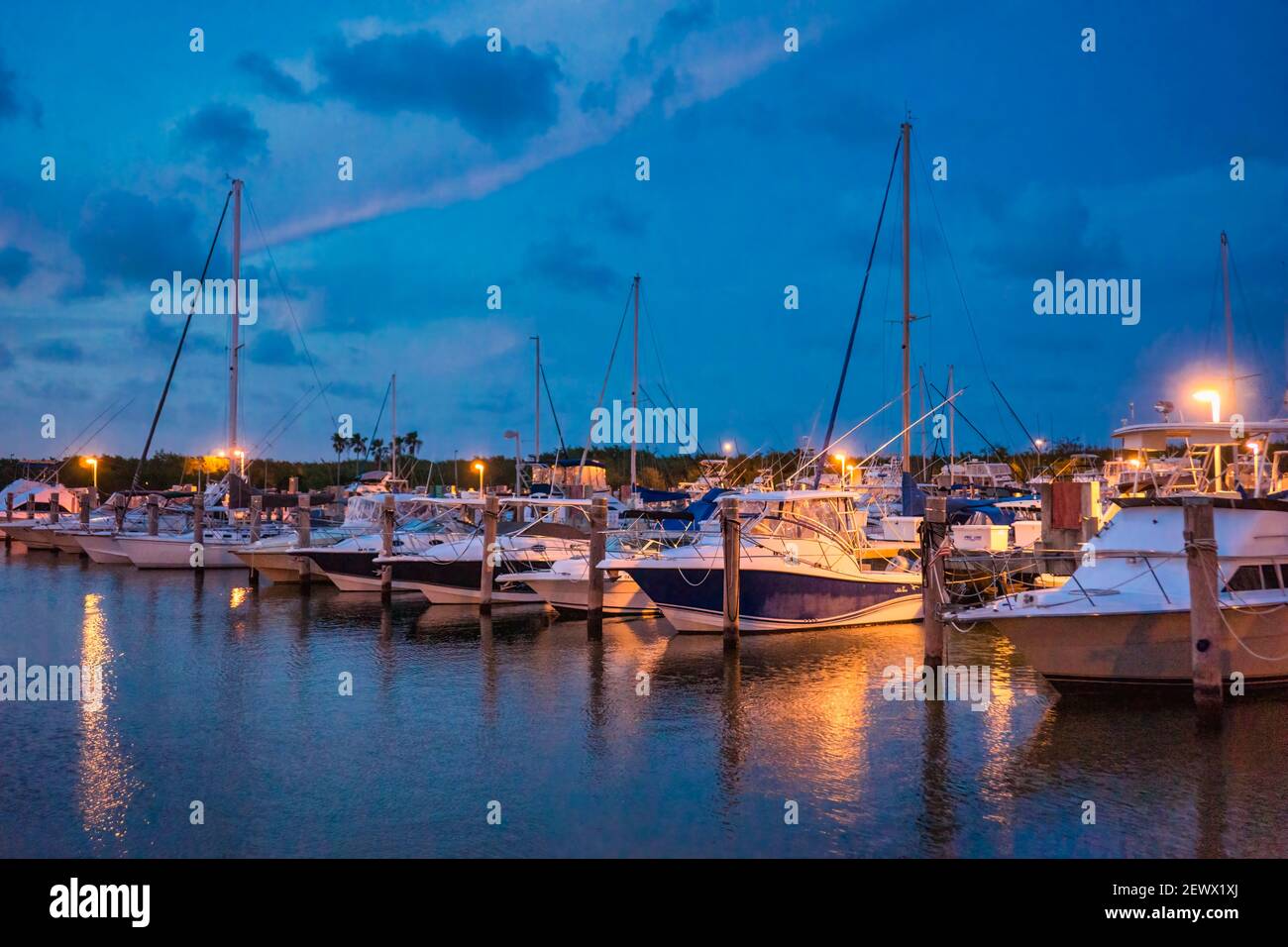Blue hour evening view of the boats docked at the Black Point Park ...