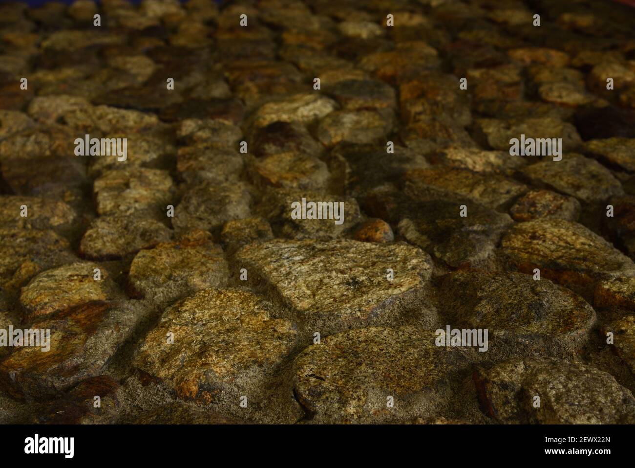 A closeup shot of an ancient dark rock and sand wall background Stock ...