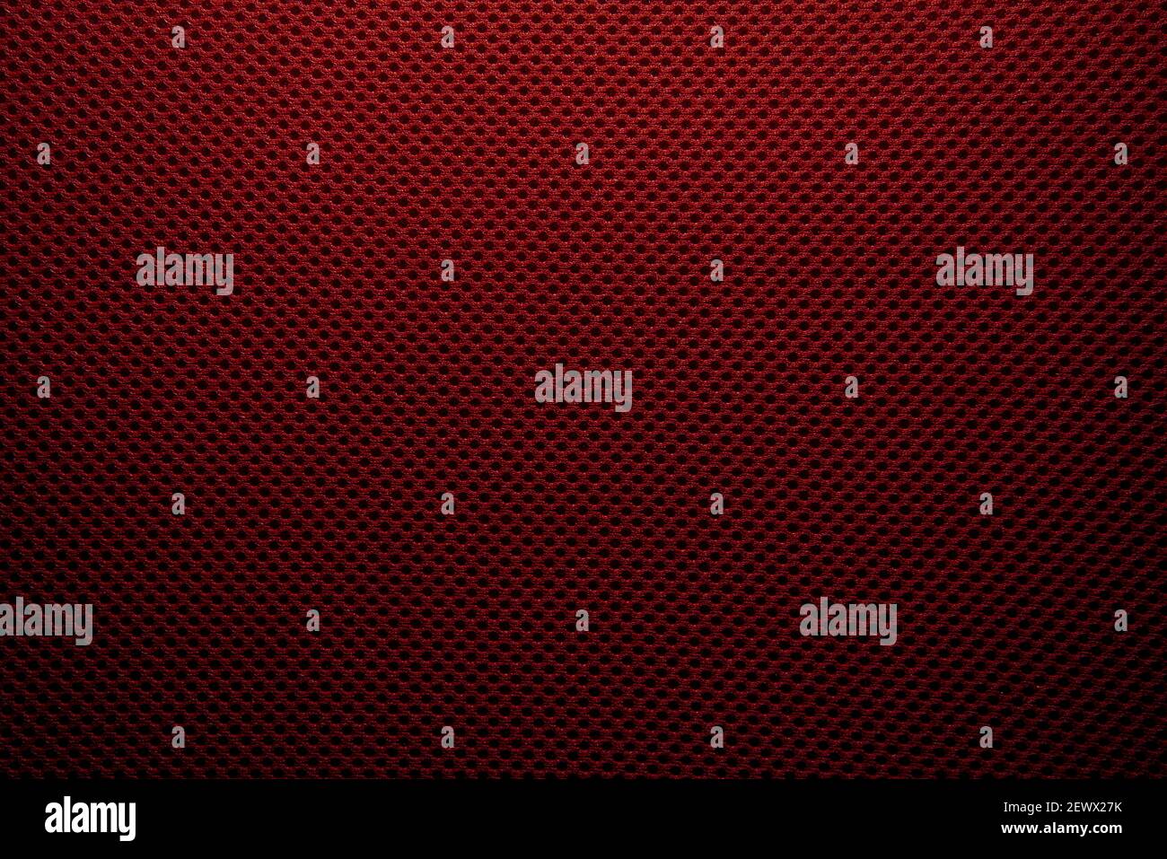 A background or wallpaper with abstract red carbon fiber textures ...