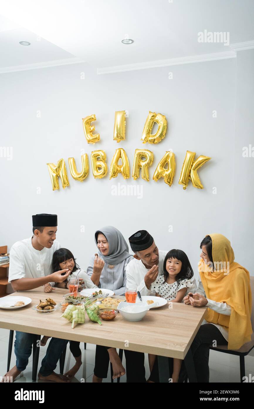 muslim asian family and grandparents having break fasting on ramadan ...