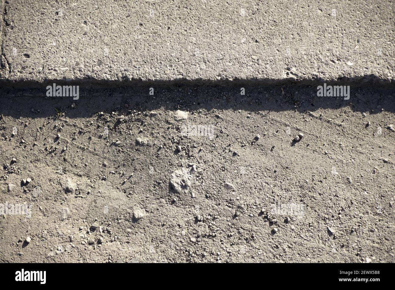 An overhead shot of a sandy and rocky ground surface Stock Photo - Alamy
