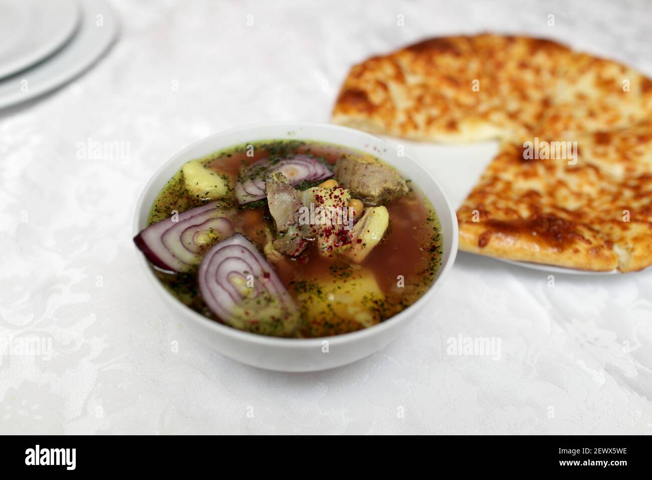Piti soup and khachapuri on a table Stock Photo - Alamy