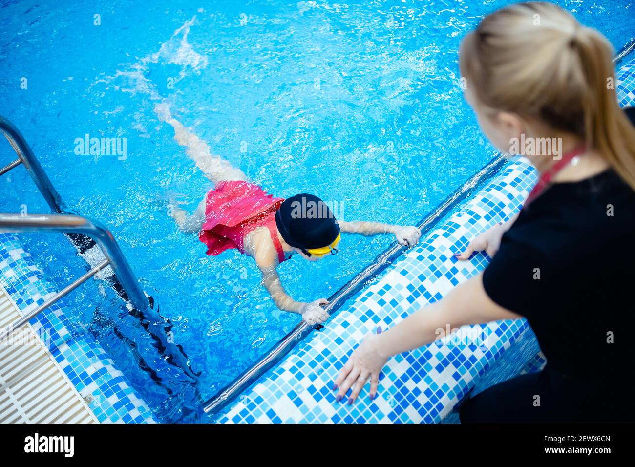 Female coach with swim team hi-res stock photography and images - Alamy