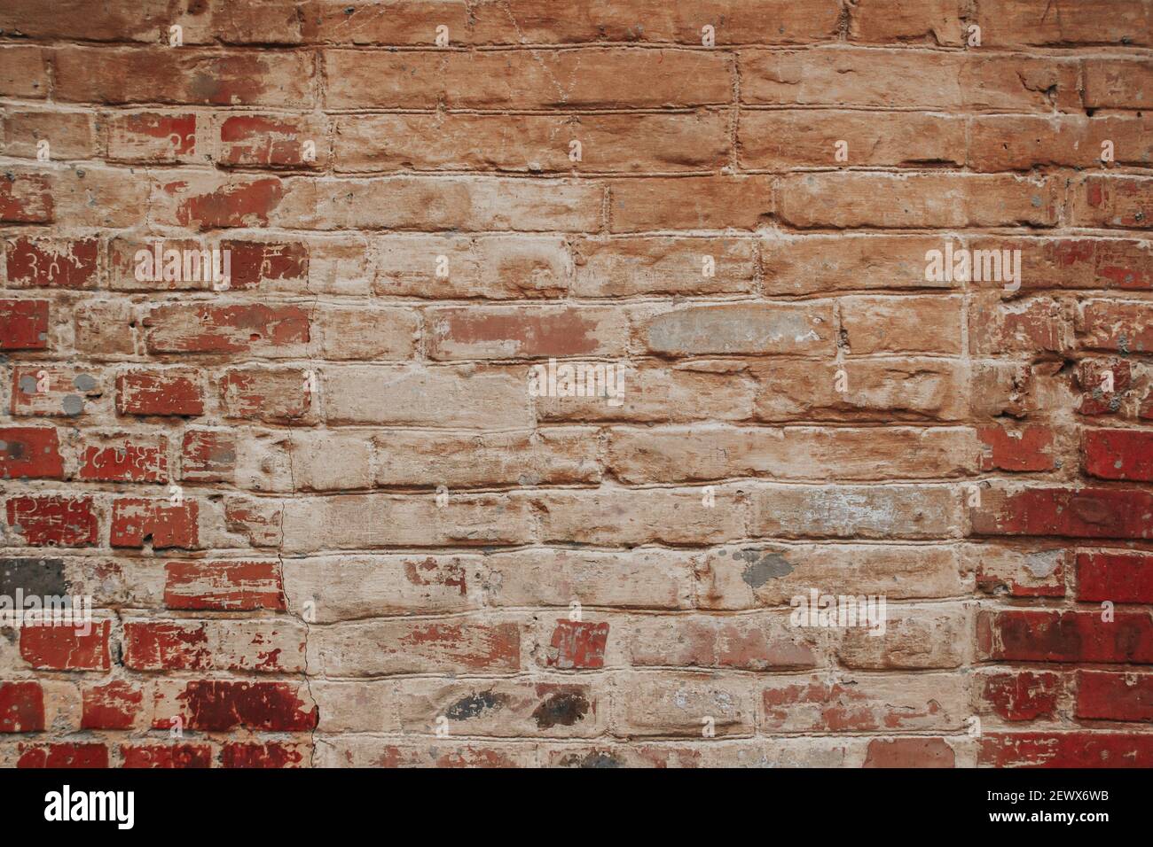 The texture of an old brick wall with natural defects. Scratches ...