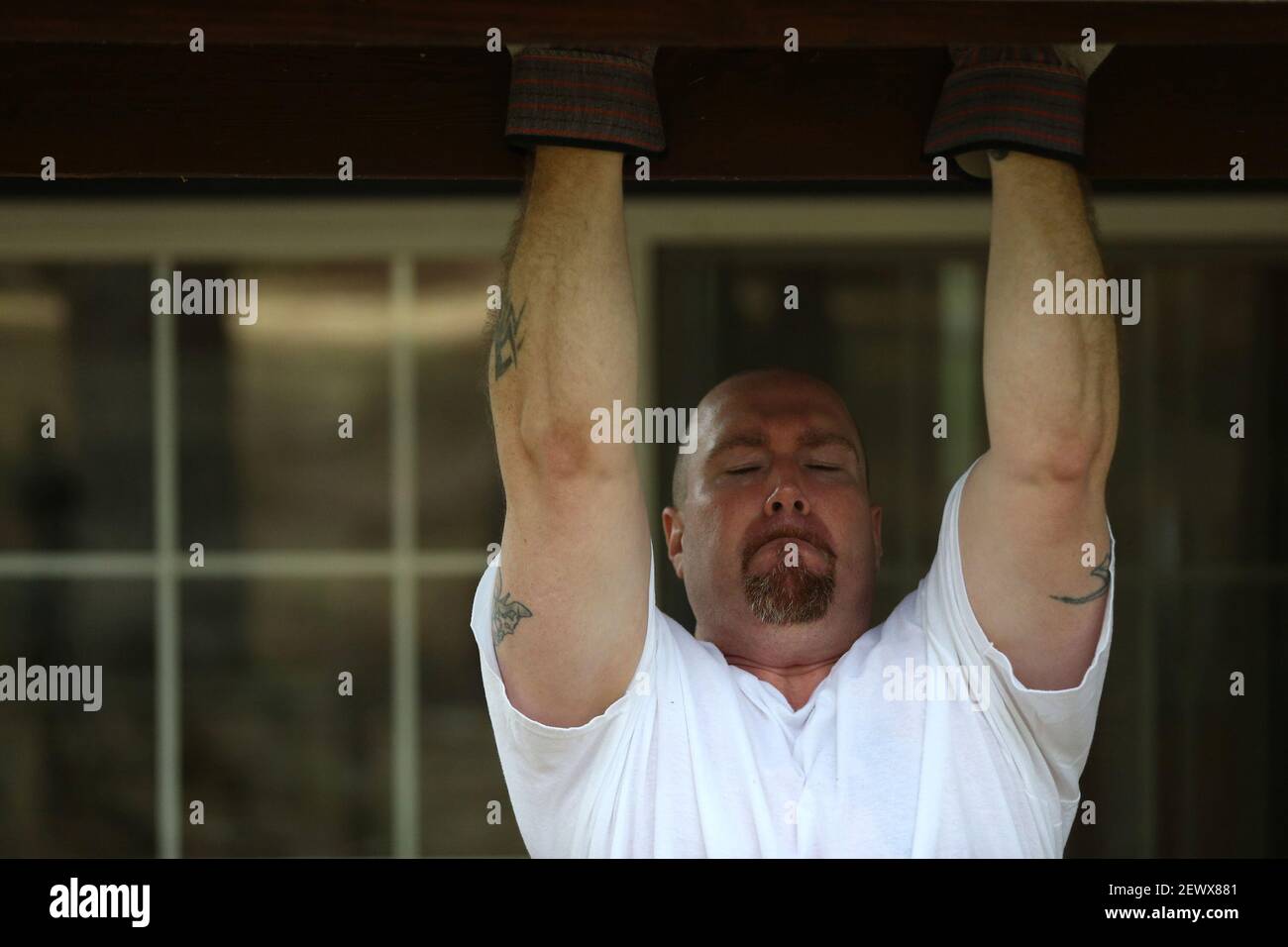 Jason Strong works out at his home in rural Tennessee on Monday, Sept ...