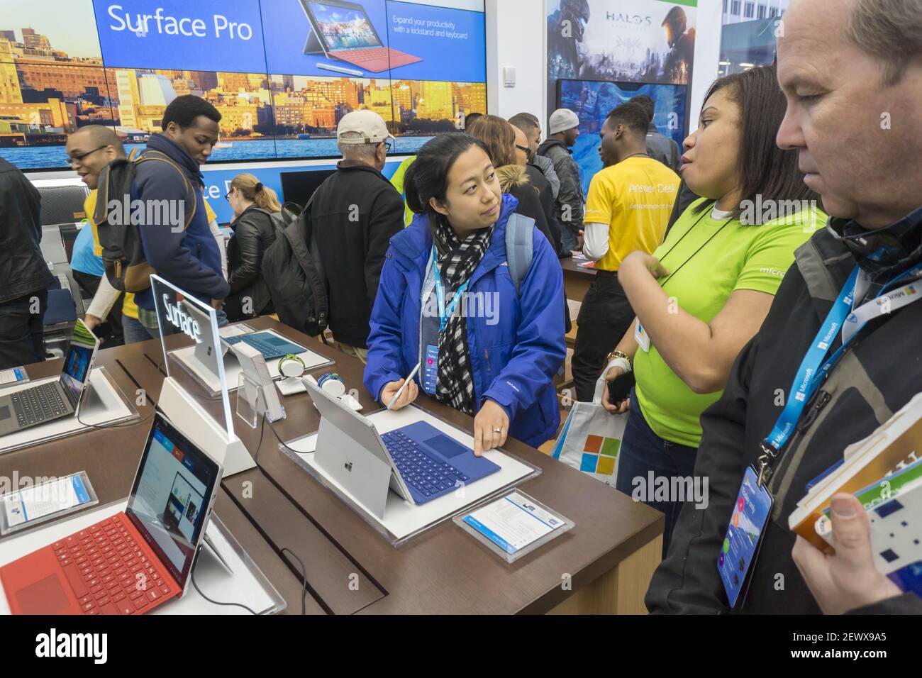 Shoppers try out Surface laptops at the Microsoft flagship store on ...