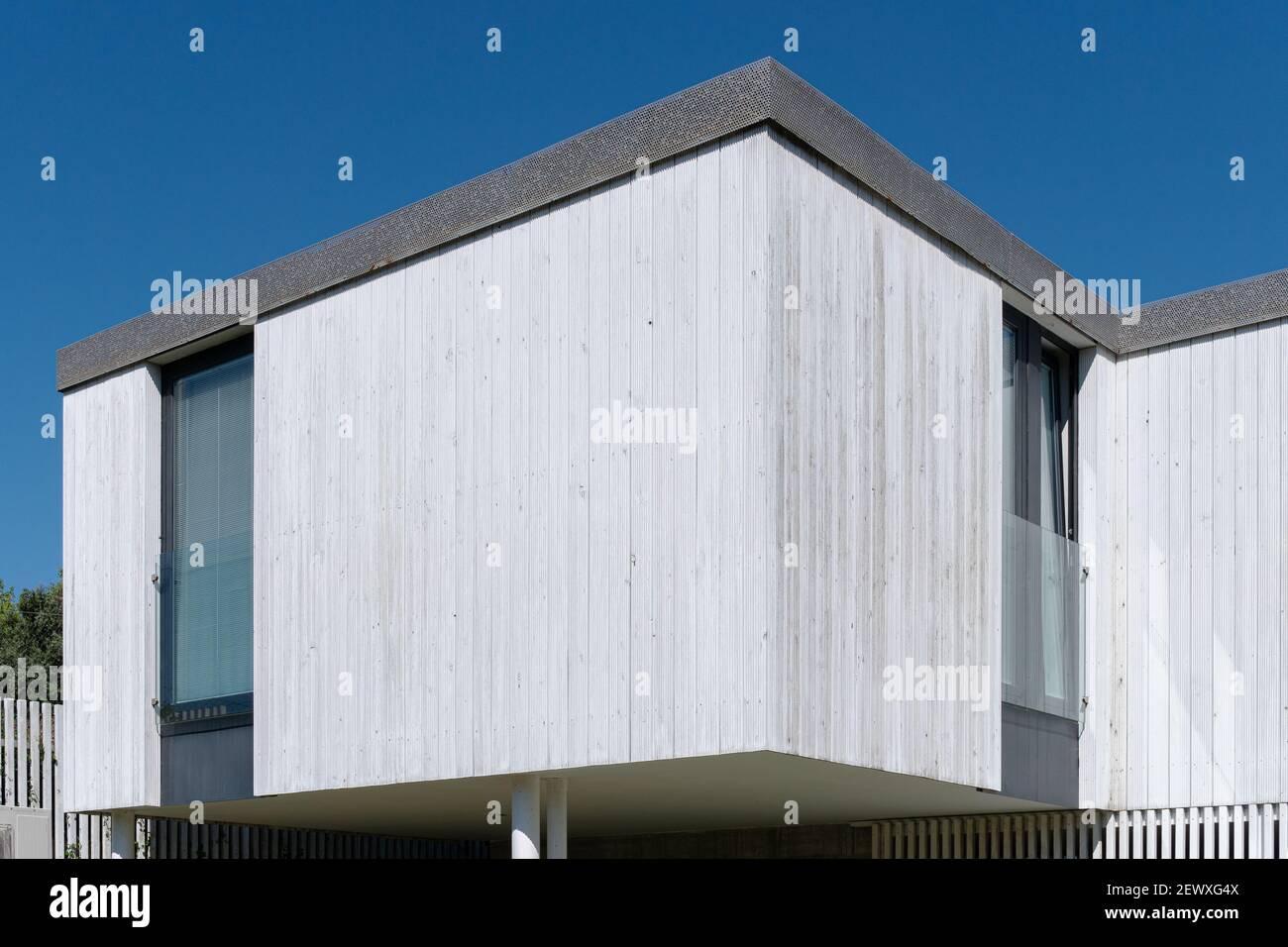 Modern House with wood paneling facade. Modern architecture Stock Photo ...