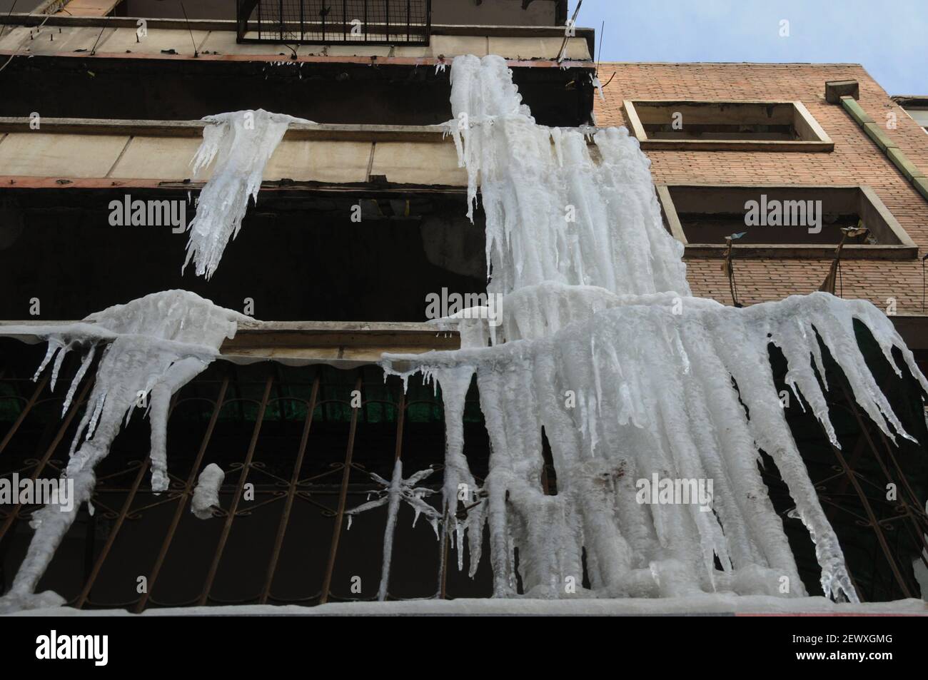 The ice fall appears on a demolition building because of leaking water ...