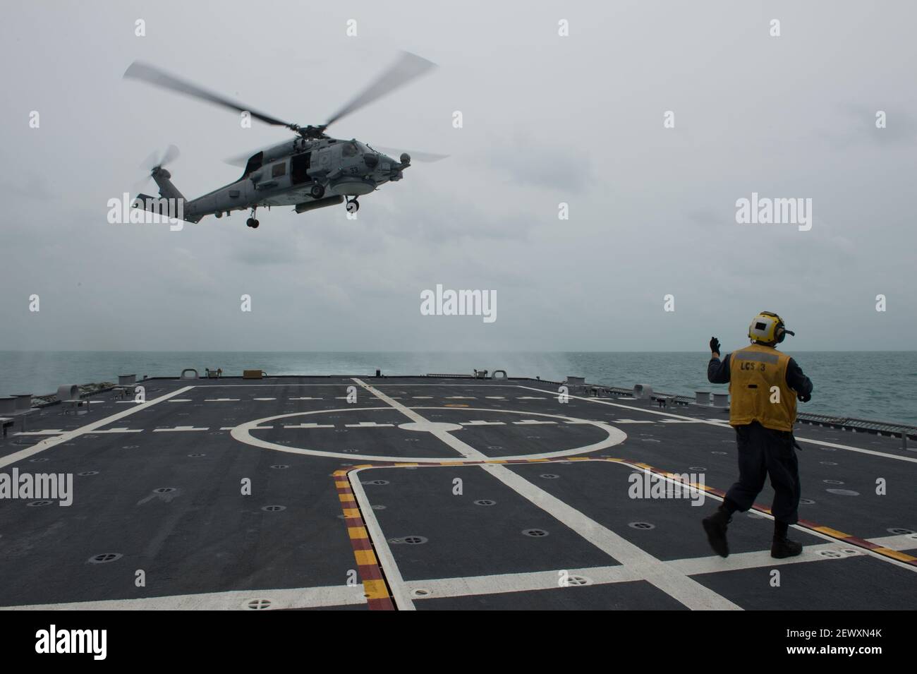INDONESIA (Jan. 3, 2015) Boatswainâ€™s Mate 2nd Class Adam Garnett ...