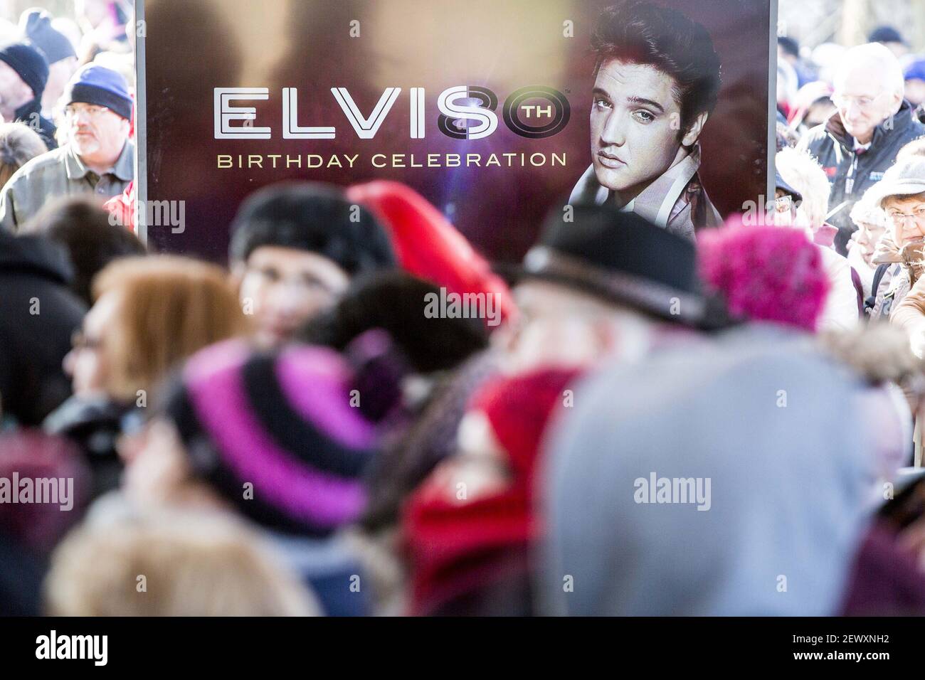 A video screen surrounded by Elvis Presley fans is seen during the 80th ...