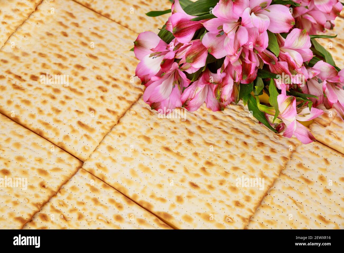 Passover background with matzah and flowers. Jewish holiday Stock Photo ...