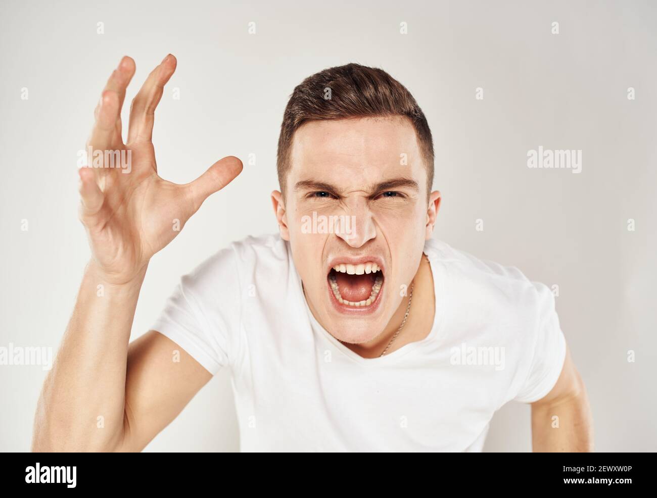 Aggressive man gestures with his hands nervousness madness model Stock ...