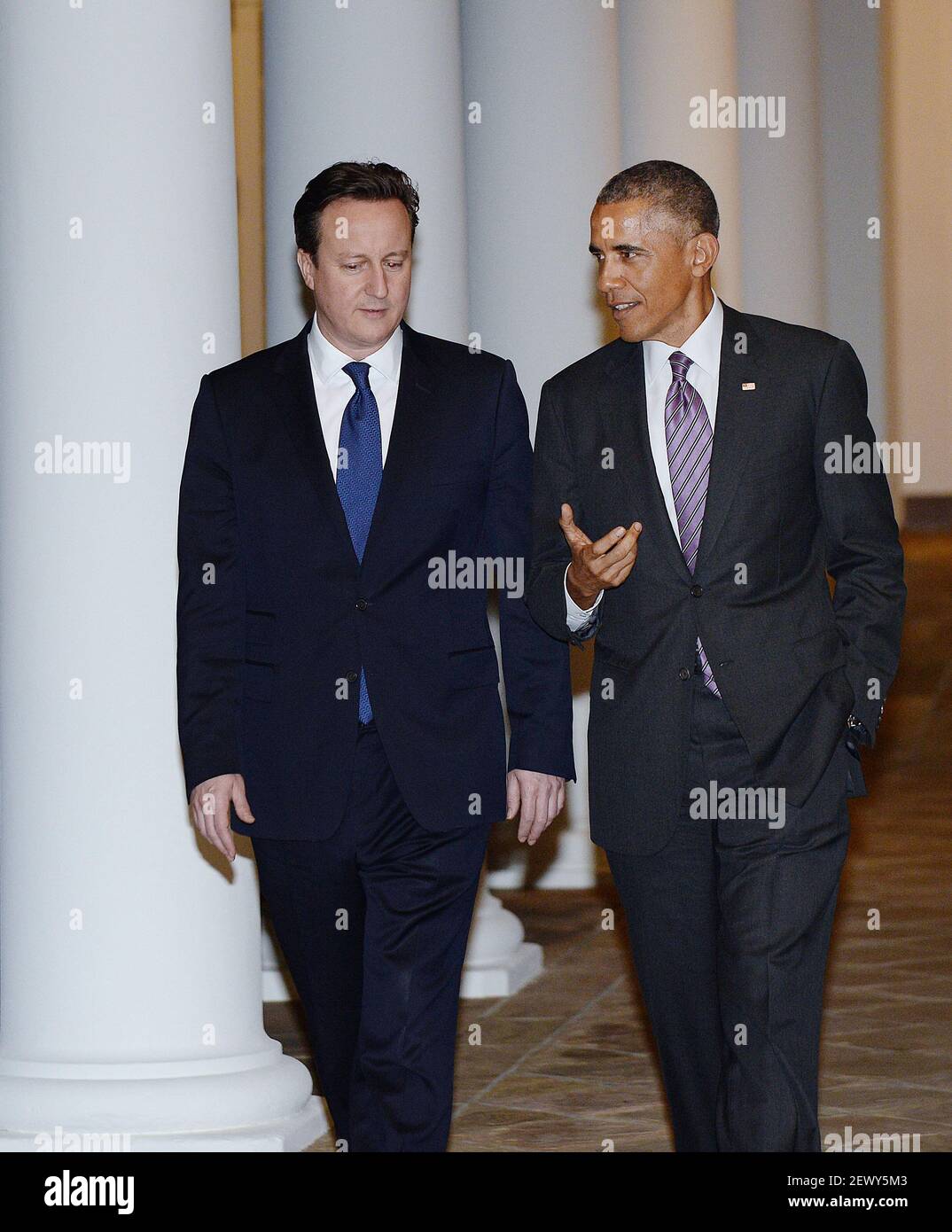 President Barack Obama and British Prime Minister David Cameron walk ...