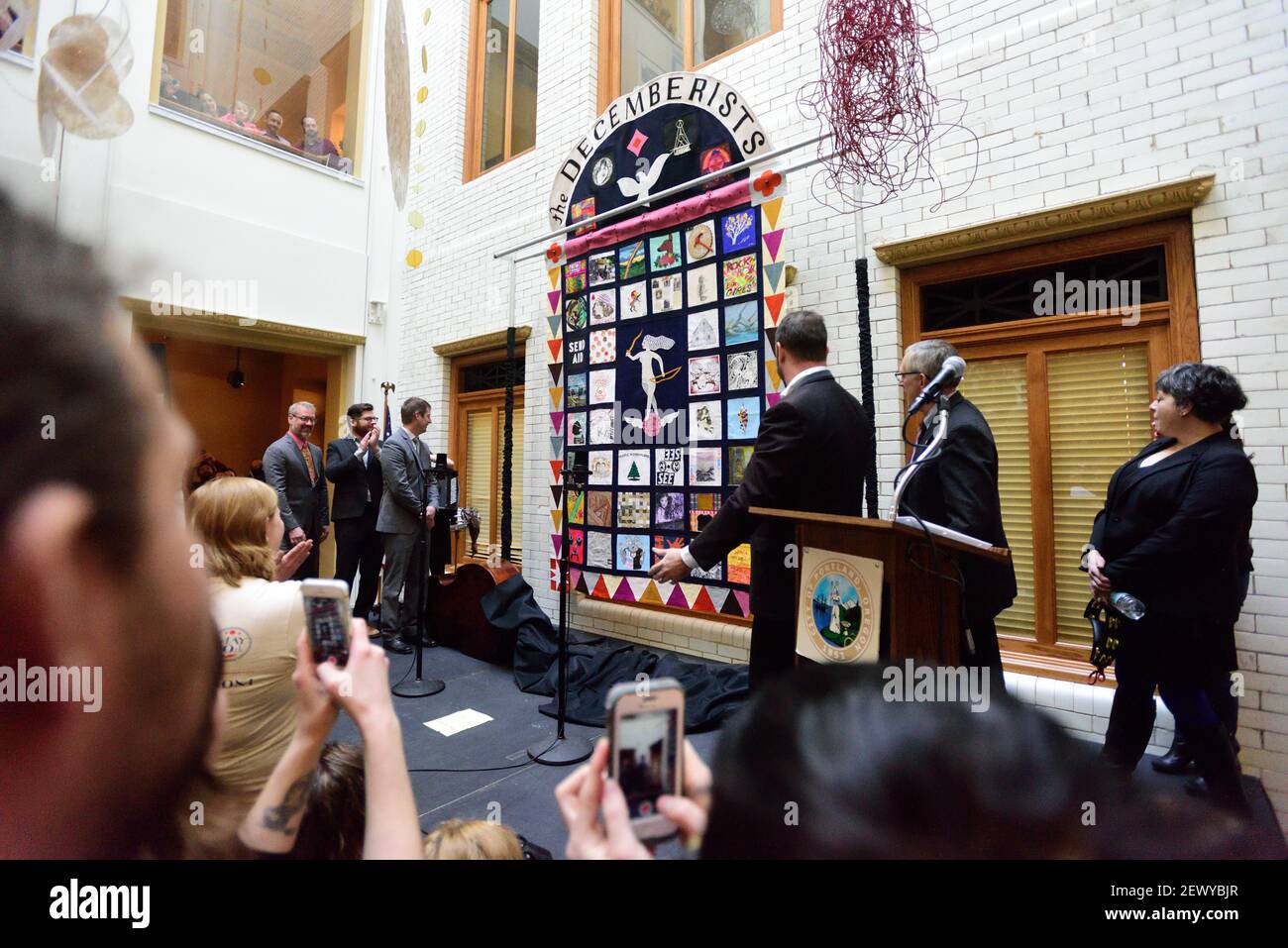 People pack the atrium of the City Hall in Portland, Ore., on January ...