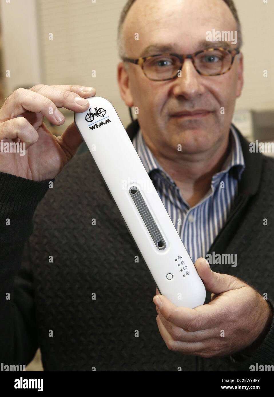 Les Levitt, CTO of Wi-MM, holds a Bike+ unit with anti-theft, GPS and ...